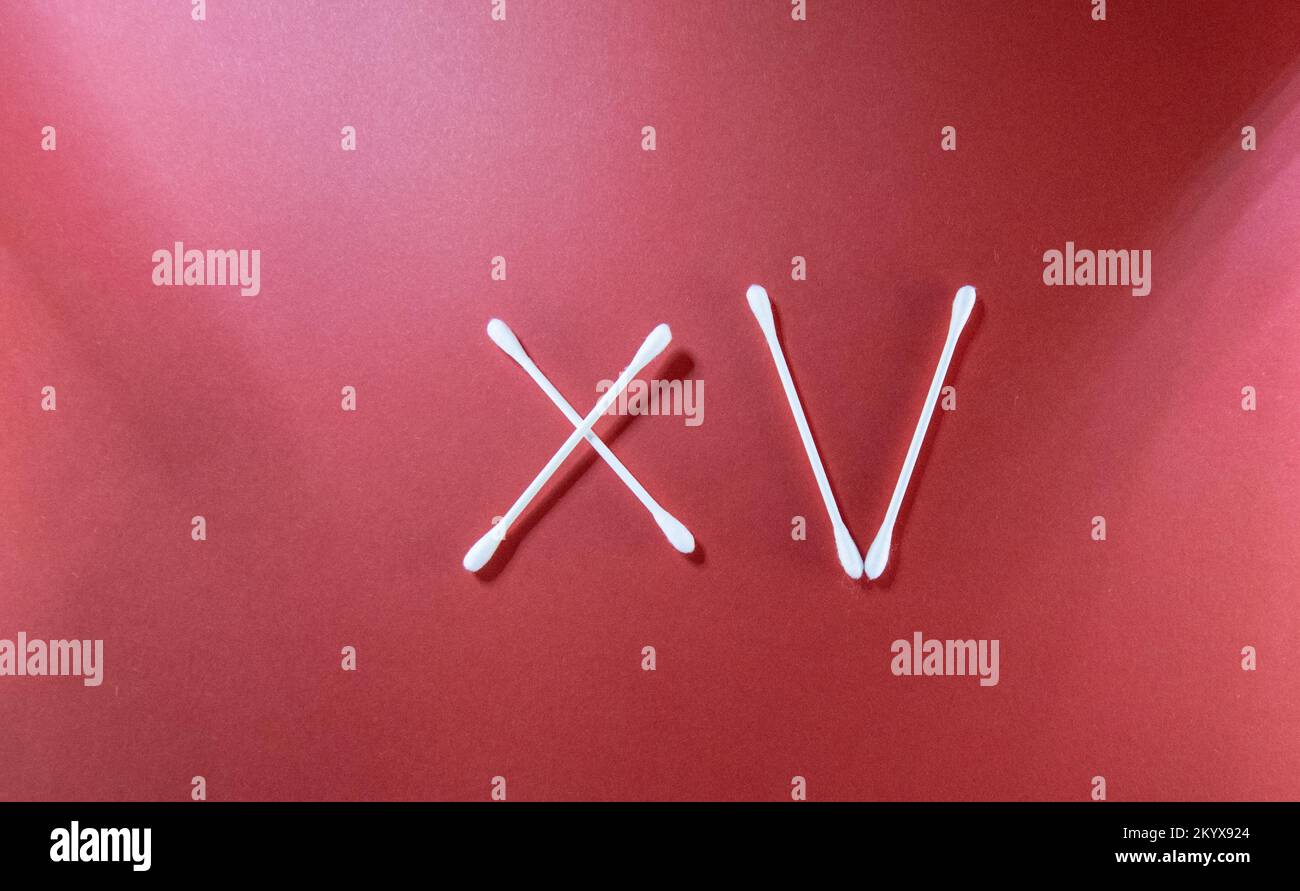 number fifteen (15) in roman numerals with clean white cotton buds ...