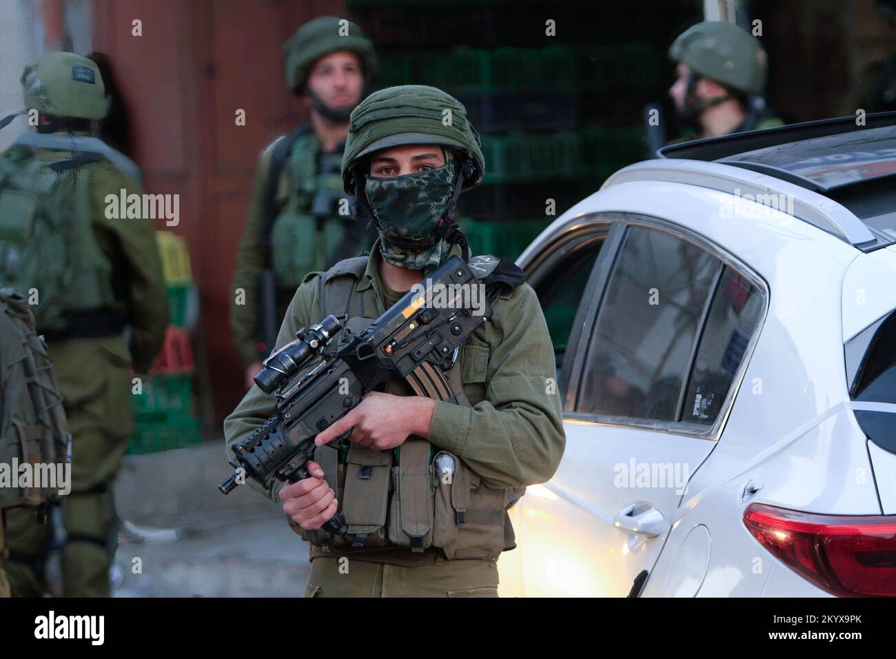 Israeli soldiers seen on guard securing the area moments after an Israeli soldier shot a ...