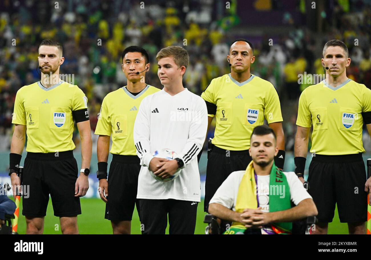 Lusail, Qatar. 2nd Dec, 2022. Referee team stand on the pitch before ...