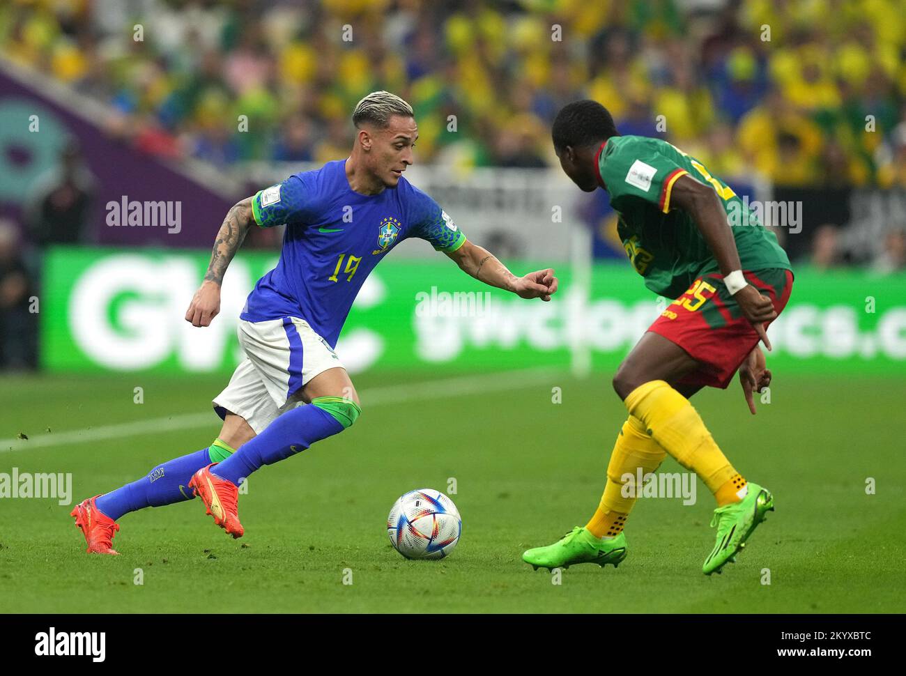 Brazil's Antony (left) and Cameroon's Tolo Nouhou battle for the ball ...
