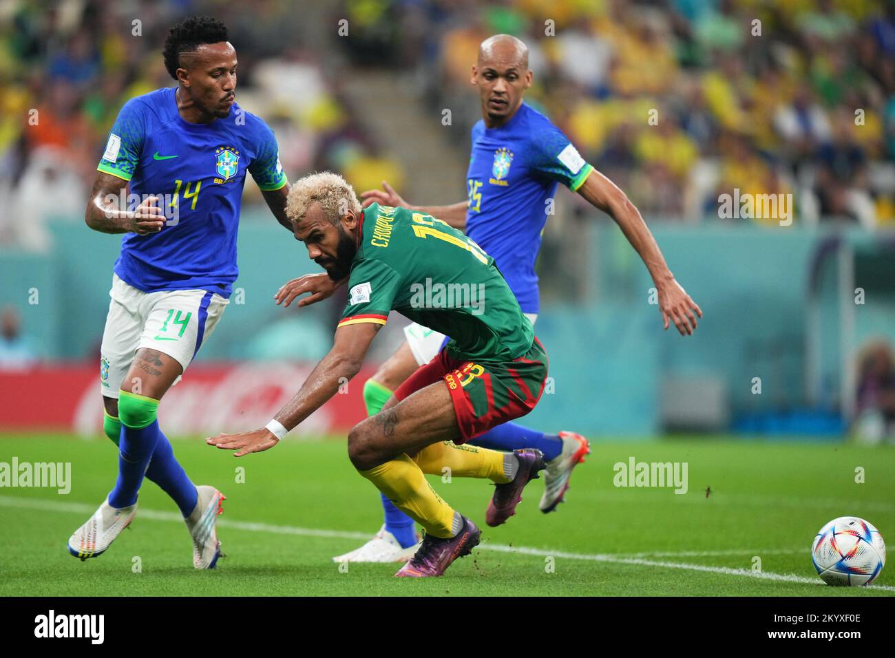 Eric Maxim Choupo-Moting of Cameroon and Daniel Alves of Brazil during ...