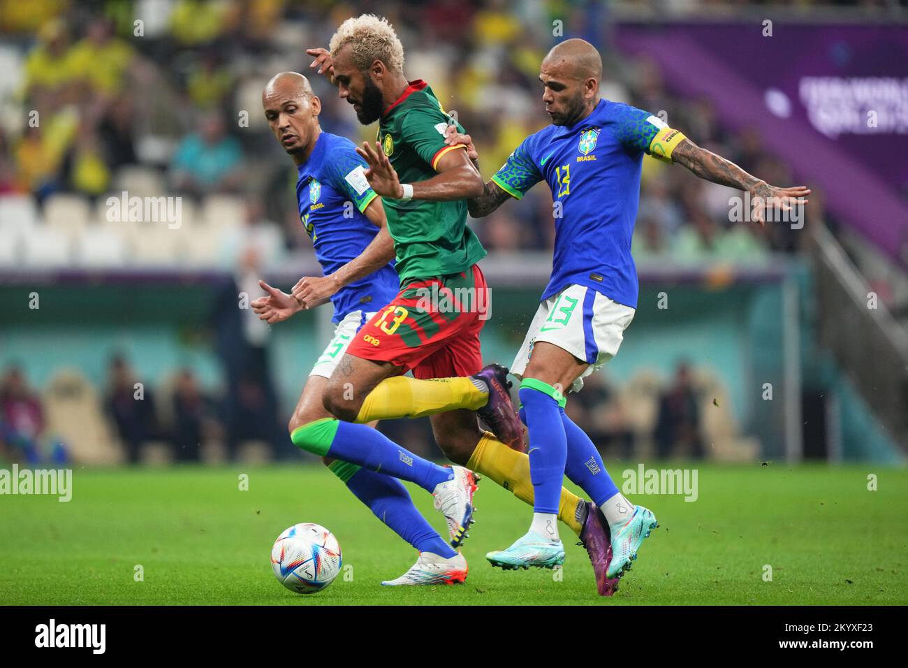 Eric Maxim Choupo-Moting of Cameroon and Daniel Alves of Brazil during ...
