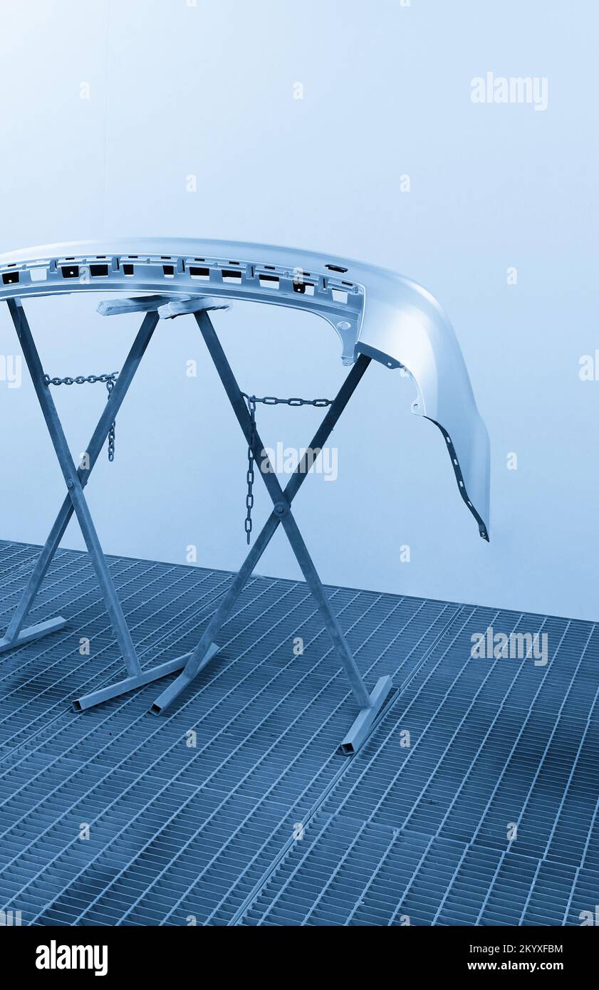 Car bumper after painting. Drying parts of the automobile in spray ...