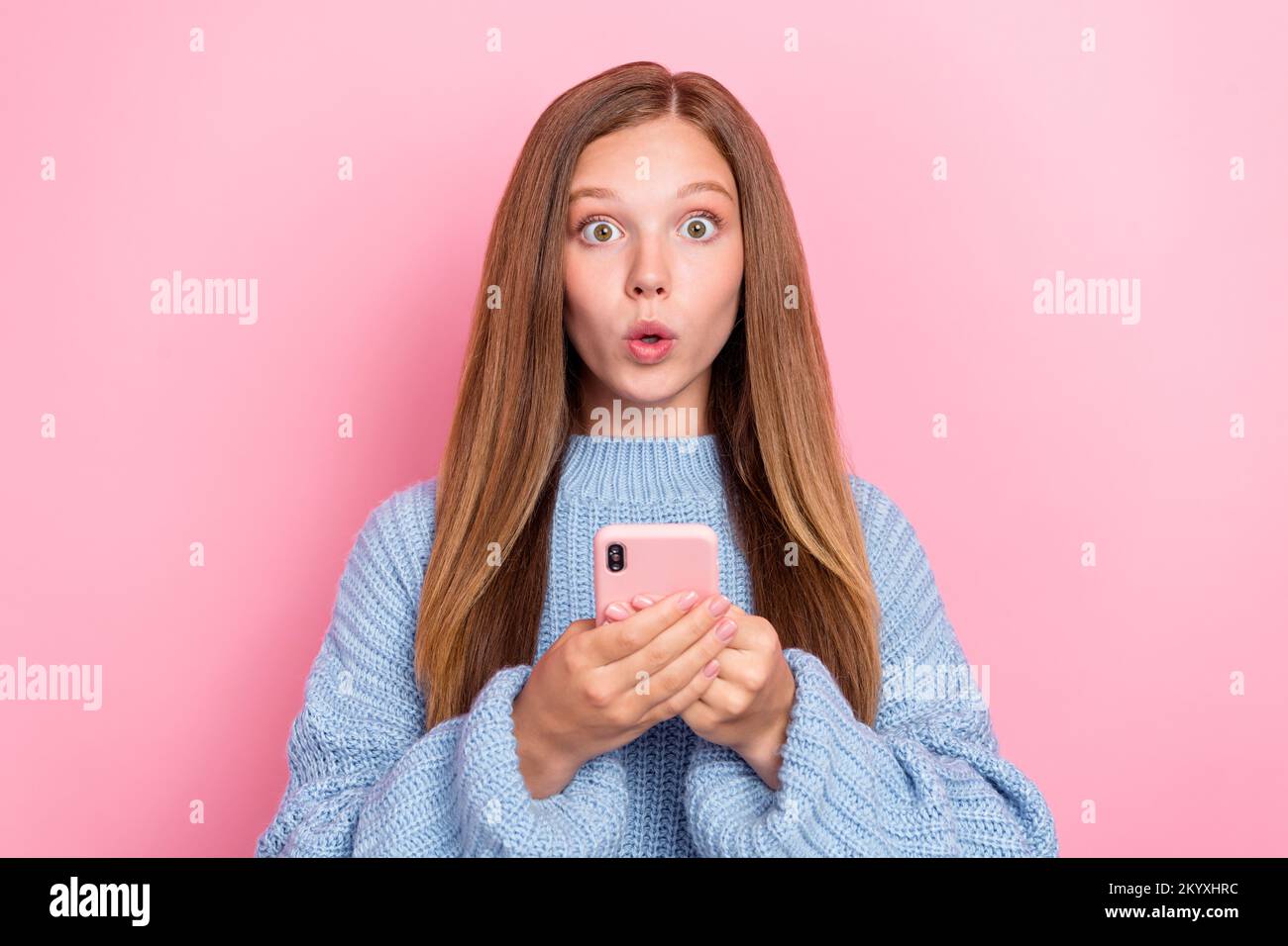 Photo of astonished lady hold modern gadget iphone sumsung impressed ...