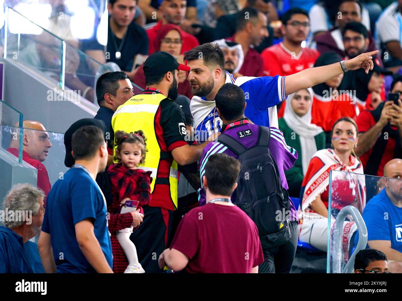 A member of security speaks to a fan in the stands during the FIFA World Cup Group G match at ...