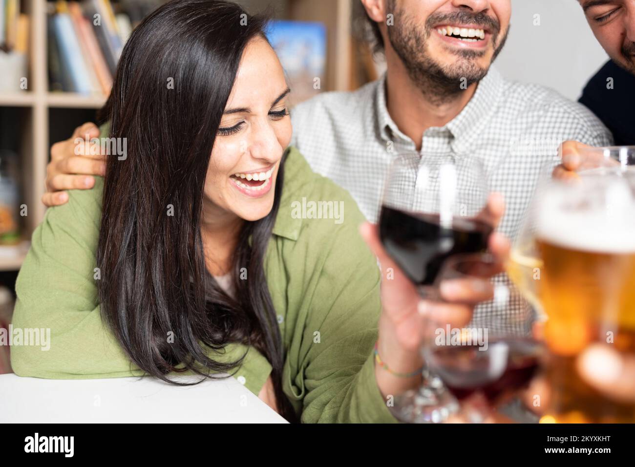 Caucasian group of friends having fun together at pub. Girl and his ...