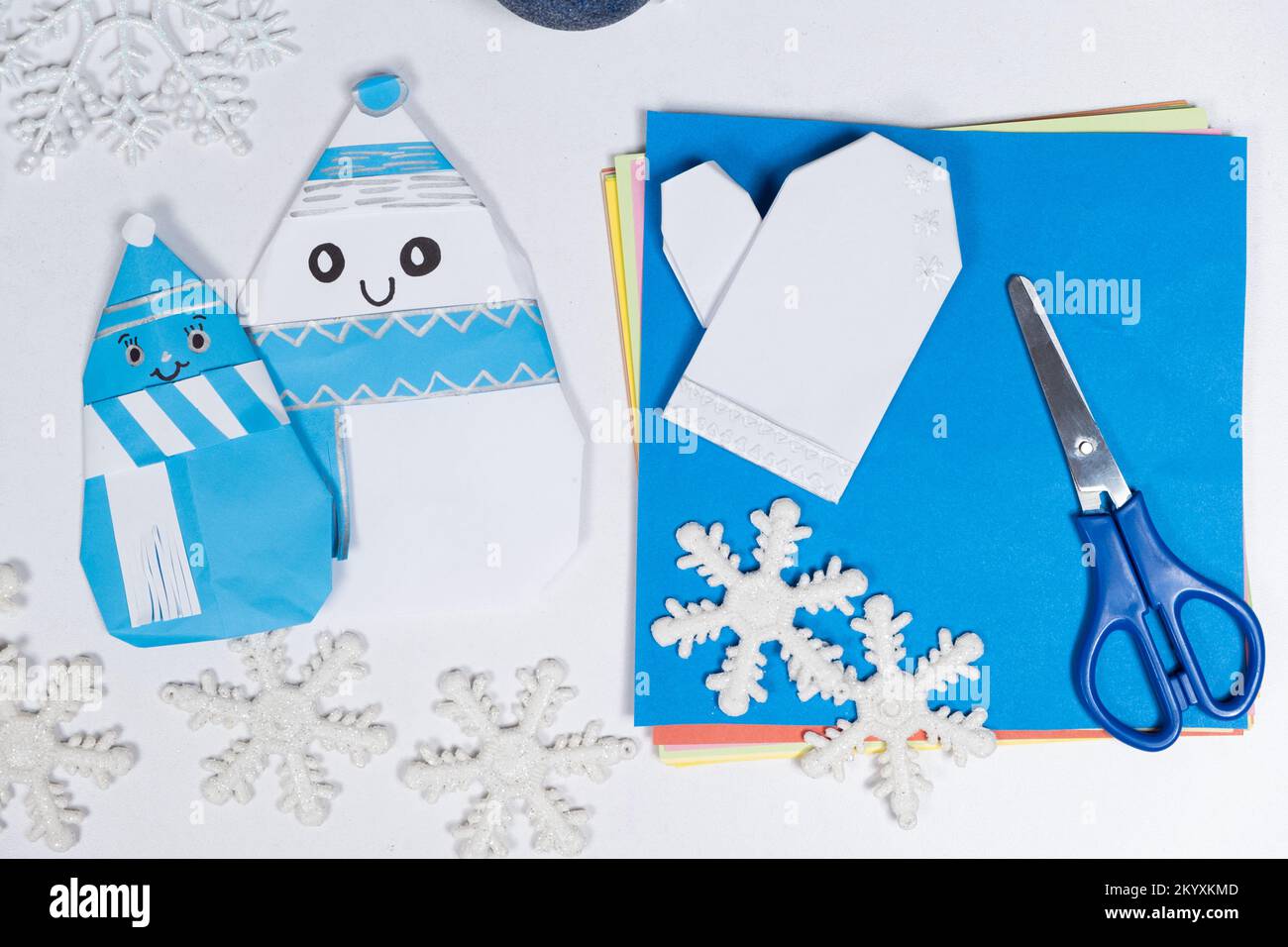 Creation of origami crafts from paper for Christmas and New Year ...