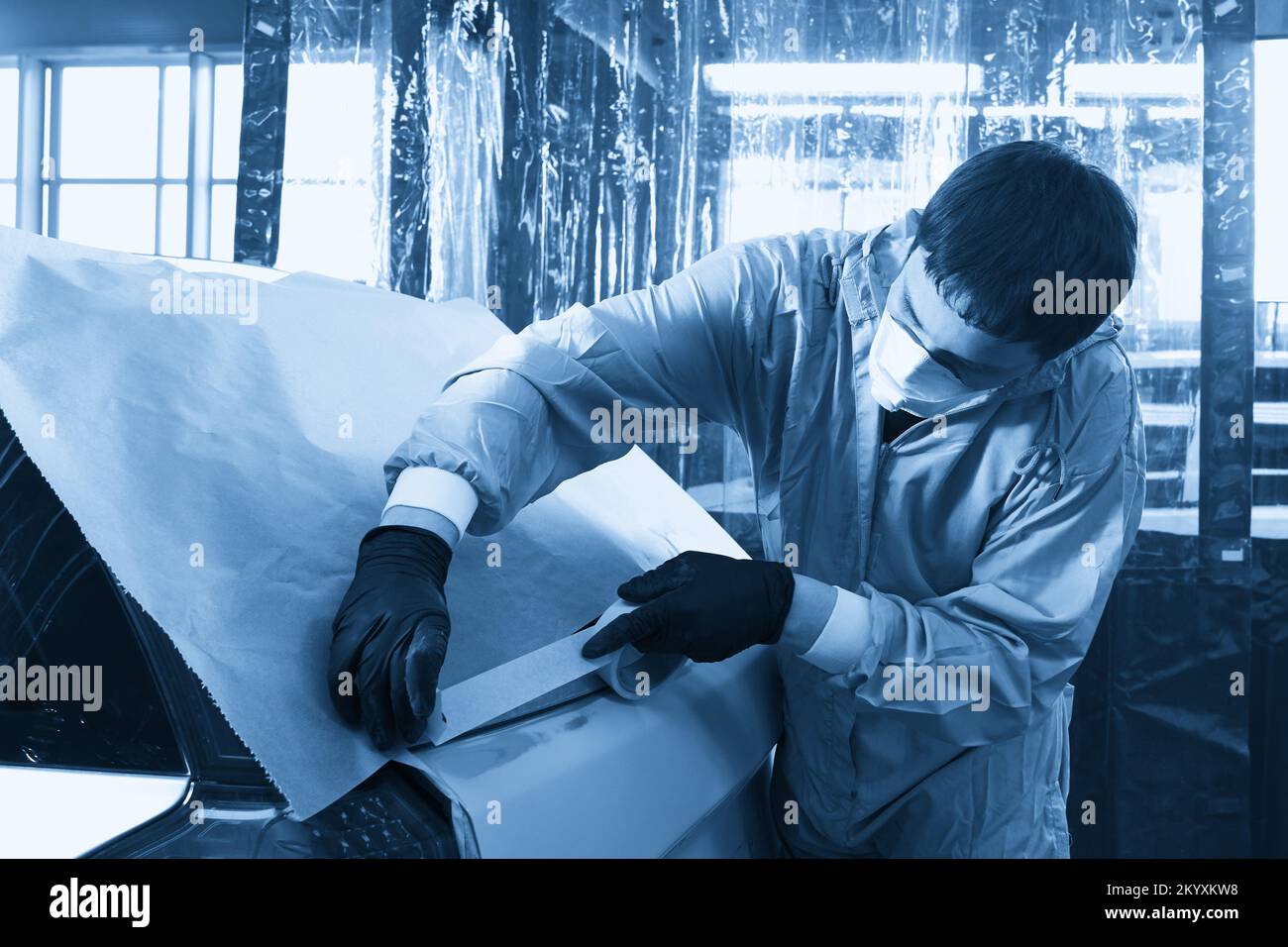 Mechanic covering car paper hi-res stock photography and images - Alamy