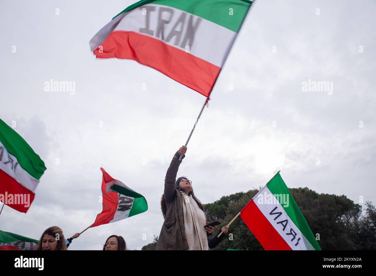 Rome, Italy. 02nd Dec, 2022. An Iranian girl waves an Iranian flag ...