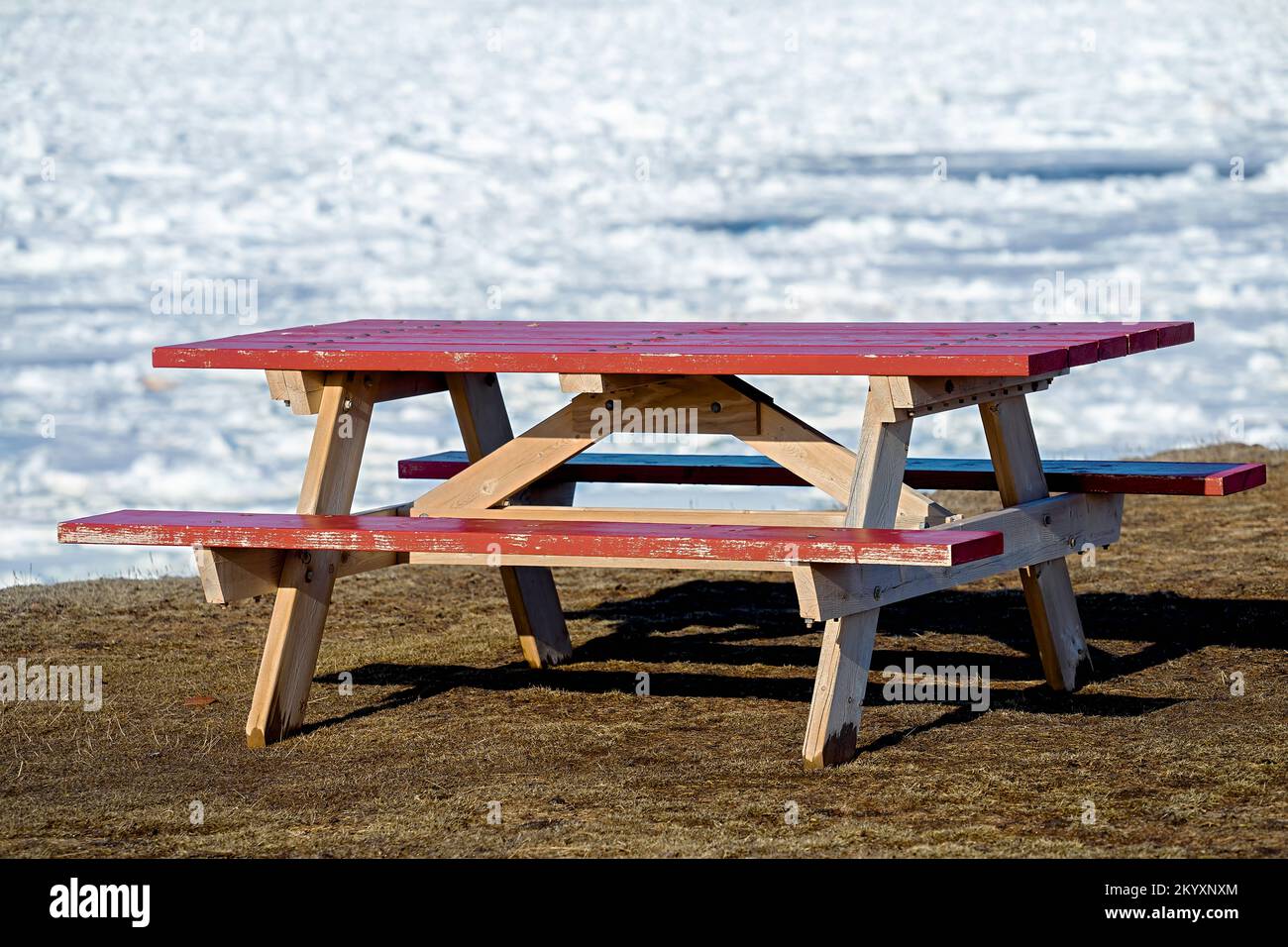Weathered red picnic table along a frozen Atlantic shore Stock Photo ...