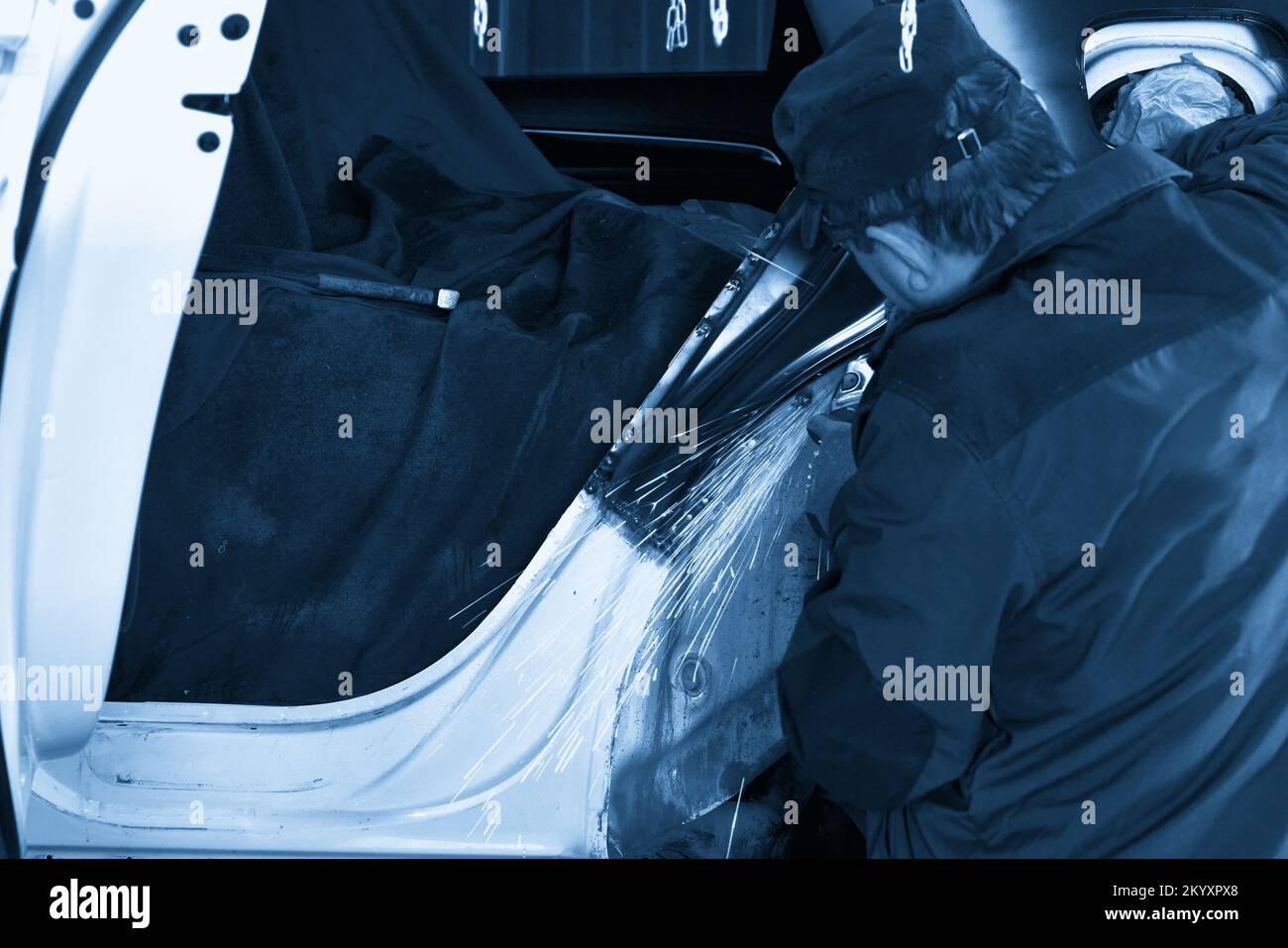 Repair service worker fix damaged car. Working with angle grinder to ...