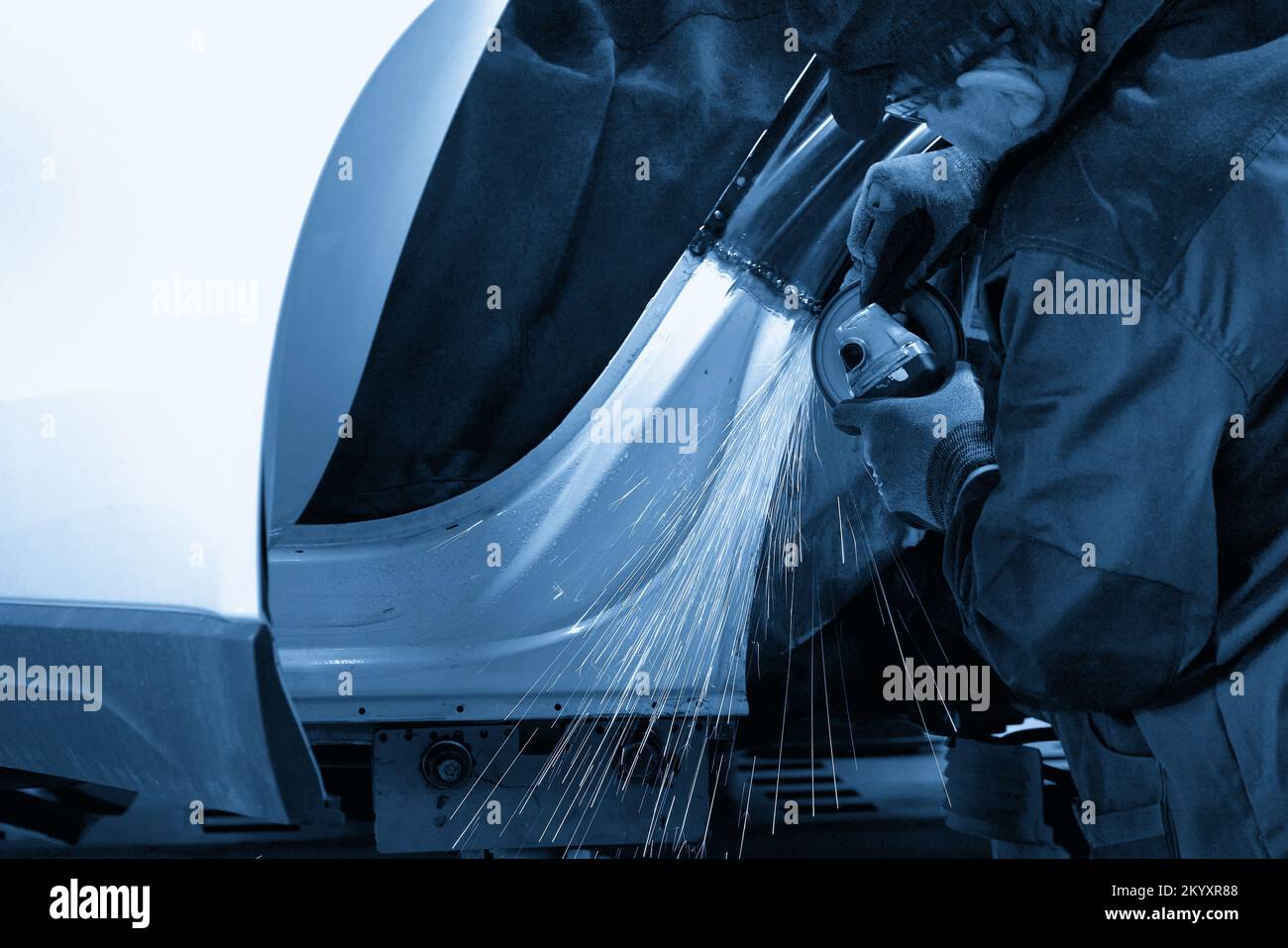 Repair service worker fix damaged car. Working with angle grinder to ...