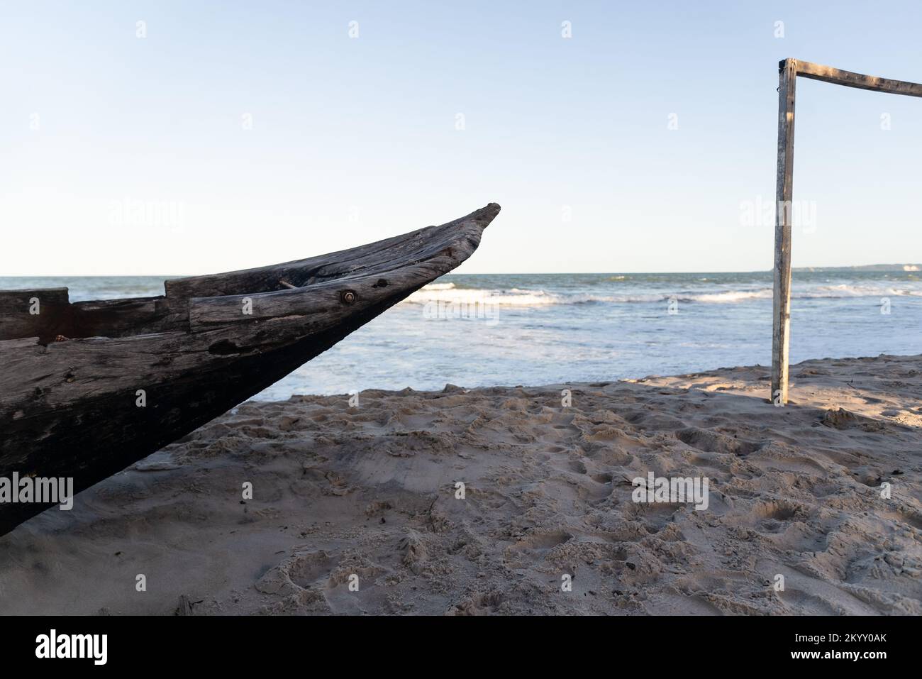 Boat on the beach sand against blue sky. City of Valenca, Brazil Stock ...