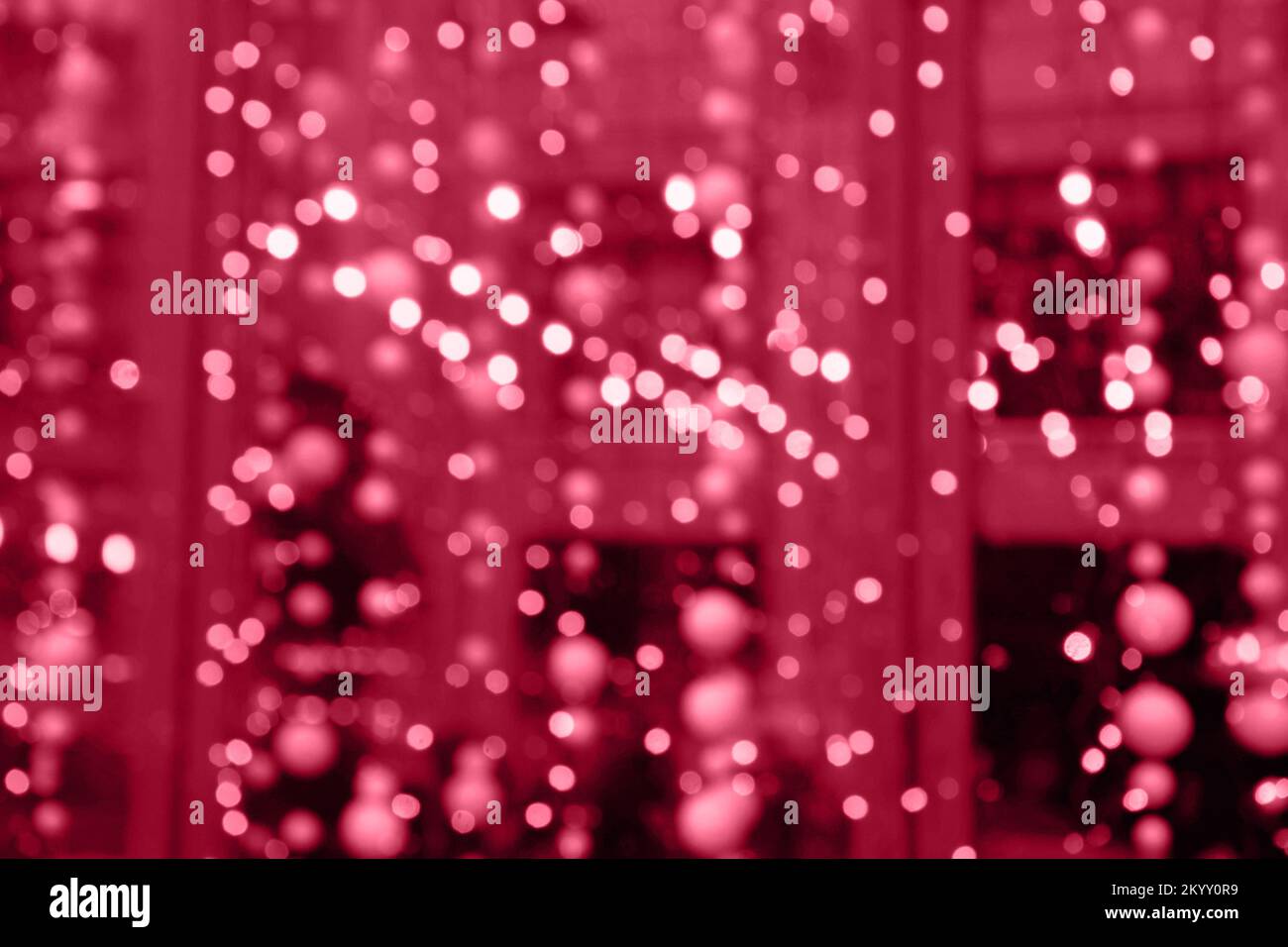 Blurred abstract viva magenta garland. City night light blur bokeh ...