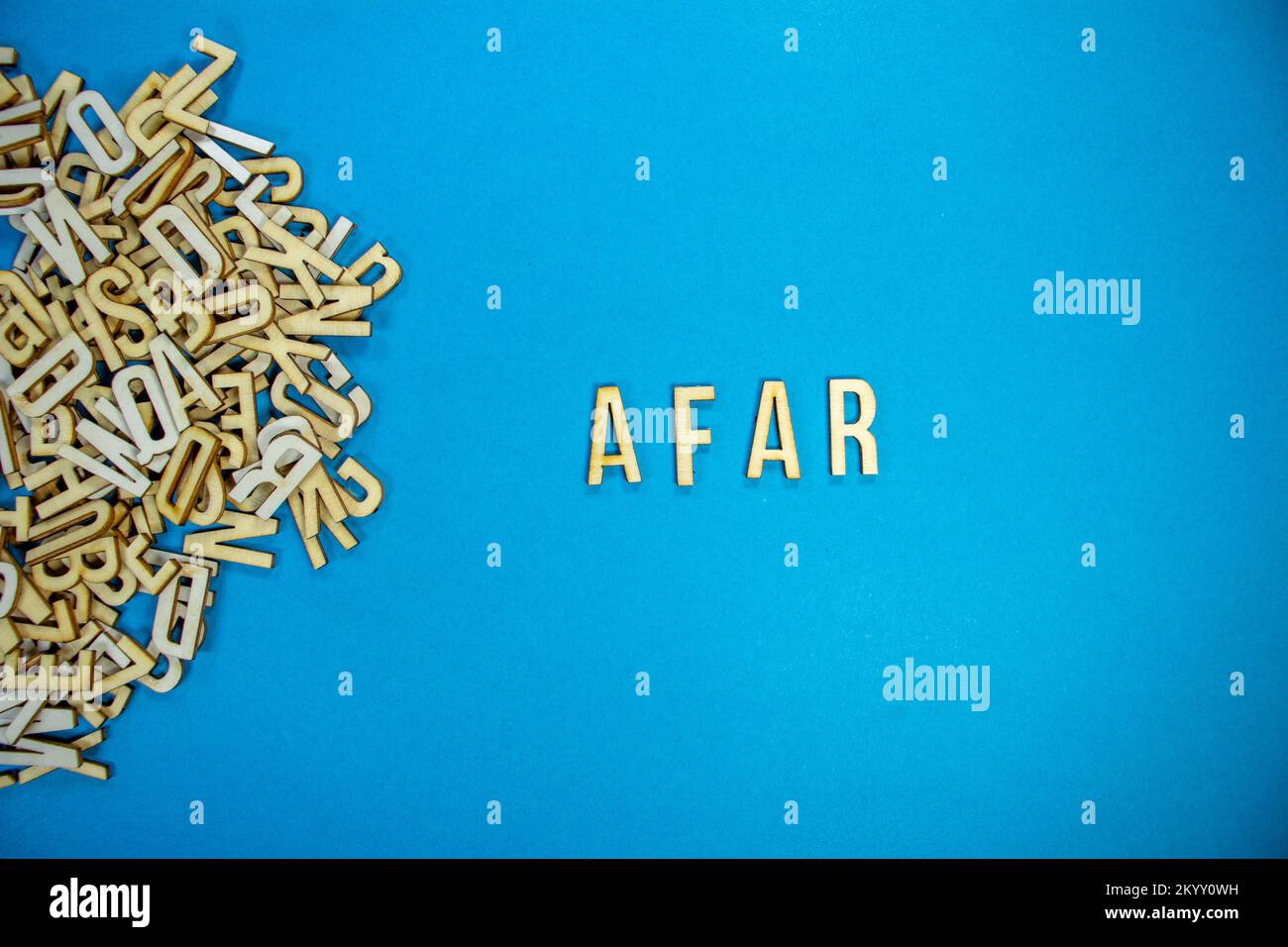 AFAR in wooden English language capital letters spilling from a pile of ...
