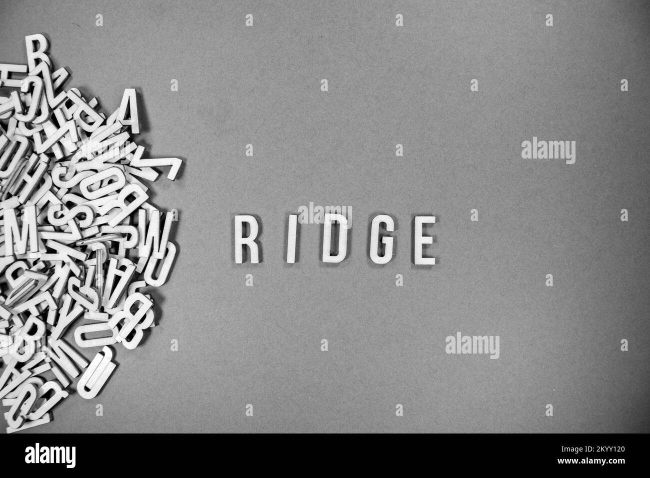 background with a pile of wooden capital letters spilling into words ...