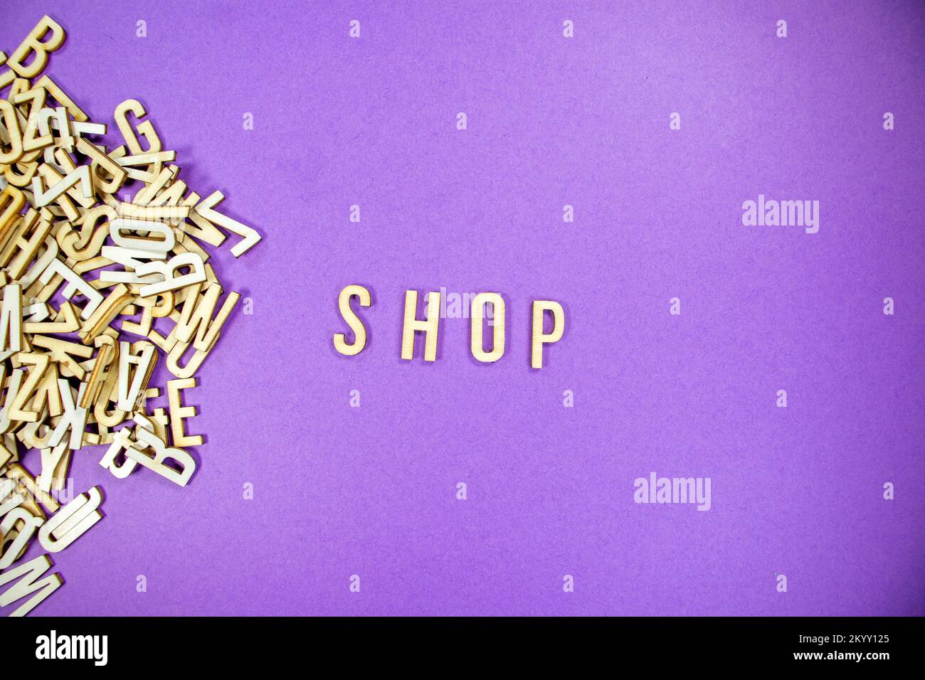 background with a pile of wooden capital letters spilling into words ...
