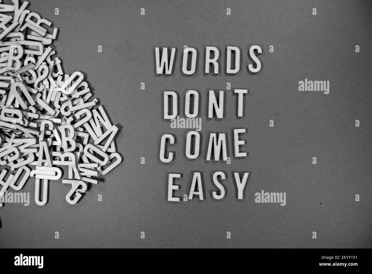 Background With A Pile Of Wooden Capital Letters Spilling Into Words Words Dont Come Easy