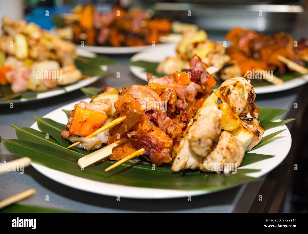 Caribbean-style kebabs of shrimp, sweet yams, bacon, and chicken fillet ...