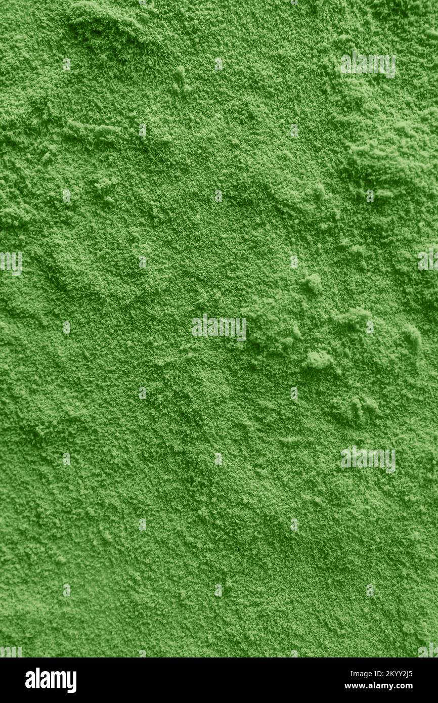 Green powder surface close-up, vivid color, abstract background Stock ...