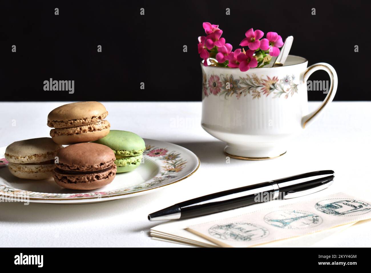 Macarons displayed on a patterned plate Stock Photo - Alamy