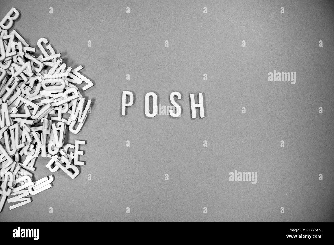 POSH in wooden English language capital letters spilling from a pile of ...