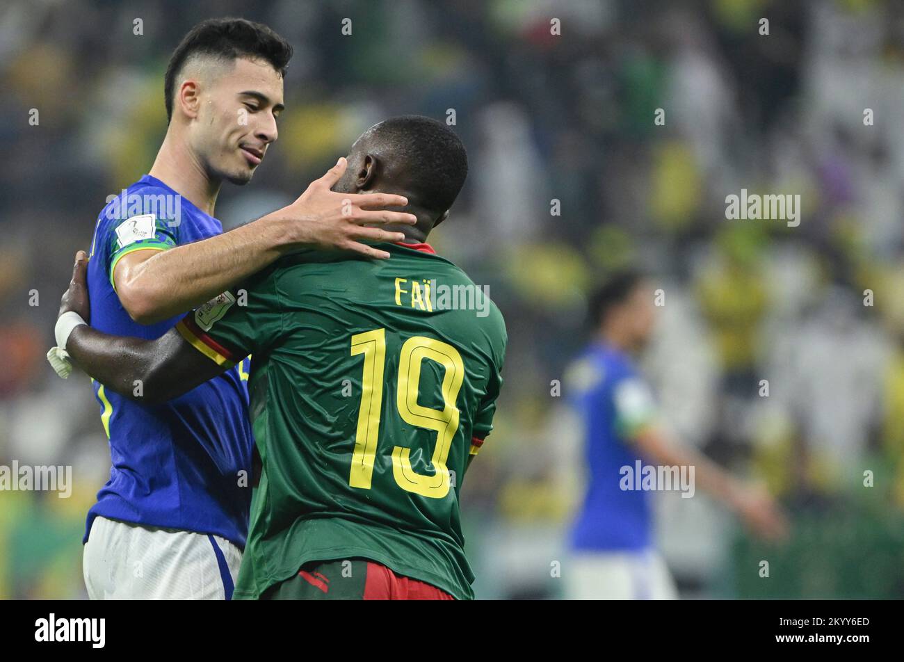 Lusail, Qatar. 2nd Dec, 2022. Gabriel Martinelli (L) of Brazil hugs ...