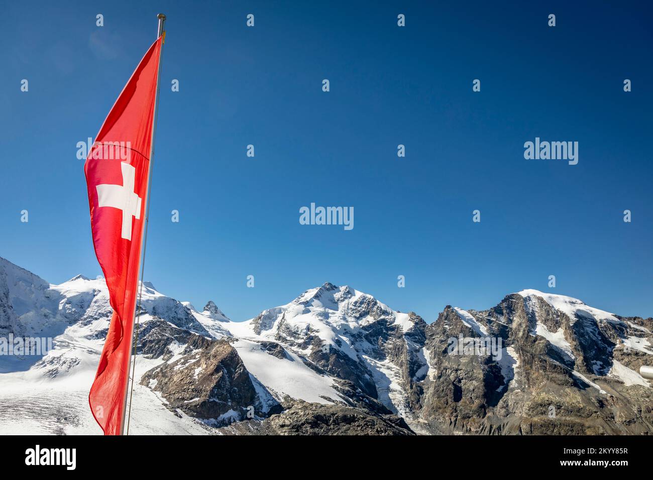 Swiss flag and Bernina mountain range with glaciers in the Alps ...