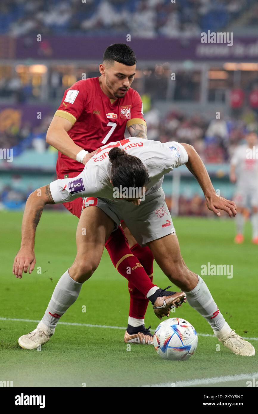 Doha, Qatar. 2nd Dec, 2022. Ricardo Rodriguez (Front) of Switzerland ...