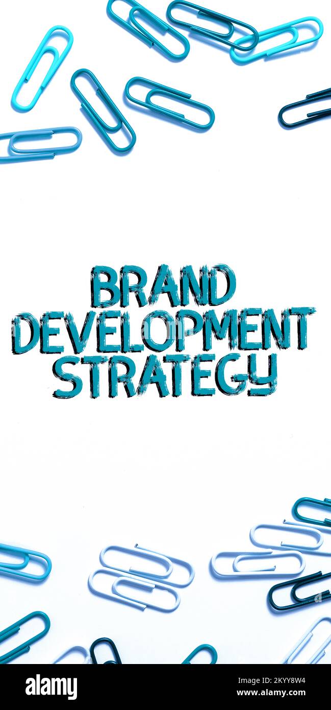 Hand writing sign Brand Development Strategy. Business overview ...