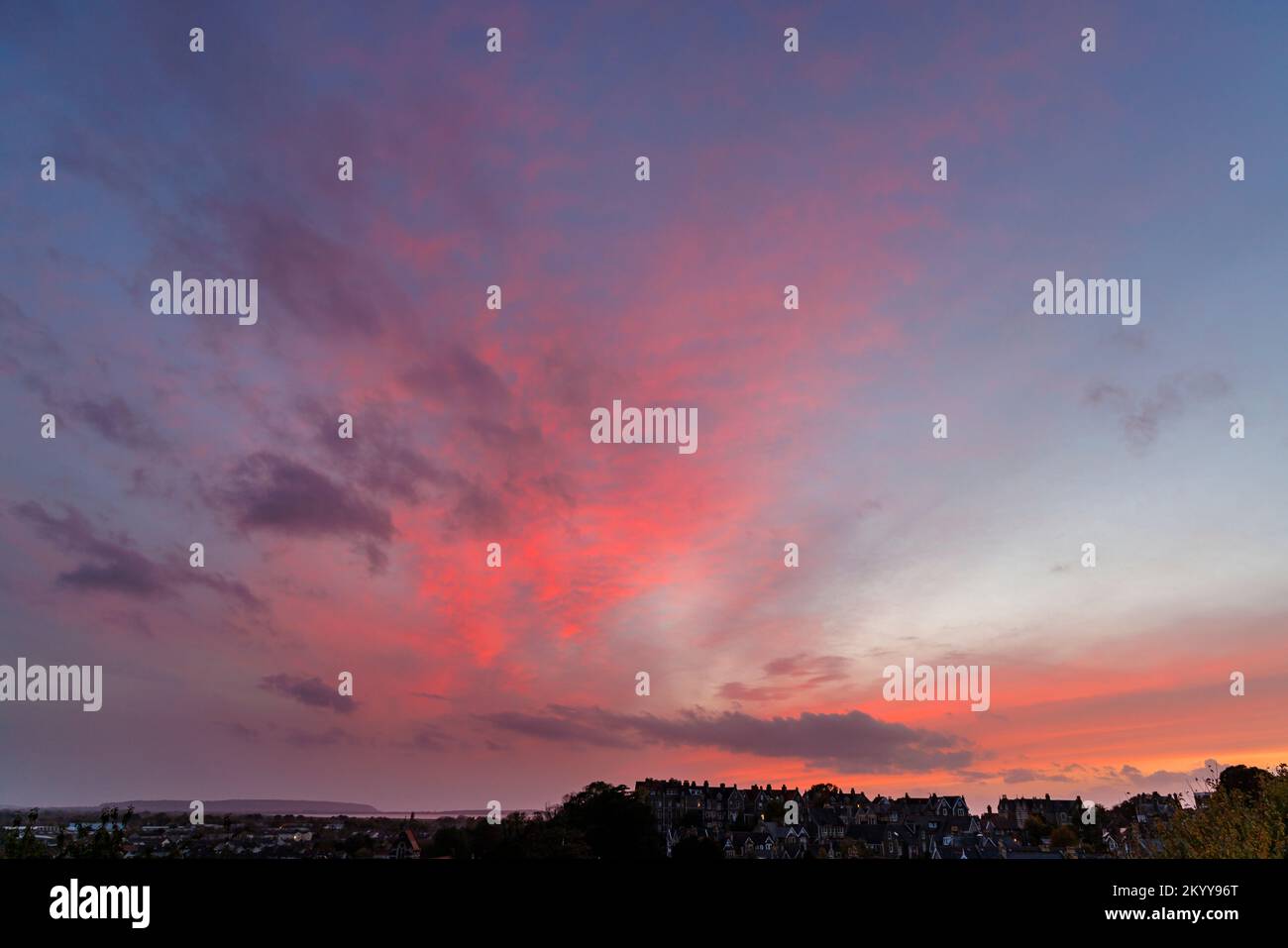 The setting sun lighting up the sky over Clevedon Stock Photo - Alamy