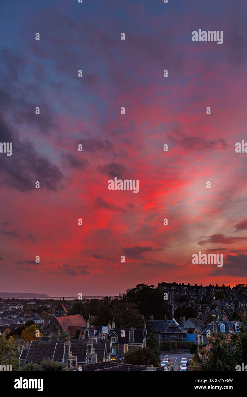 The setting sun lighting up the sky over Clevedon Stock Photo - Alamy