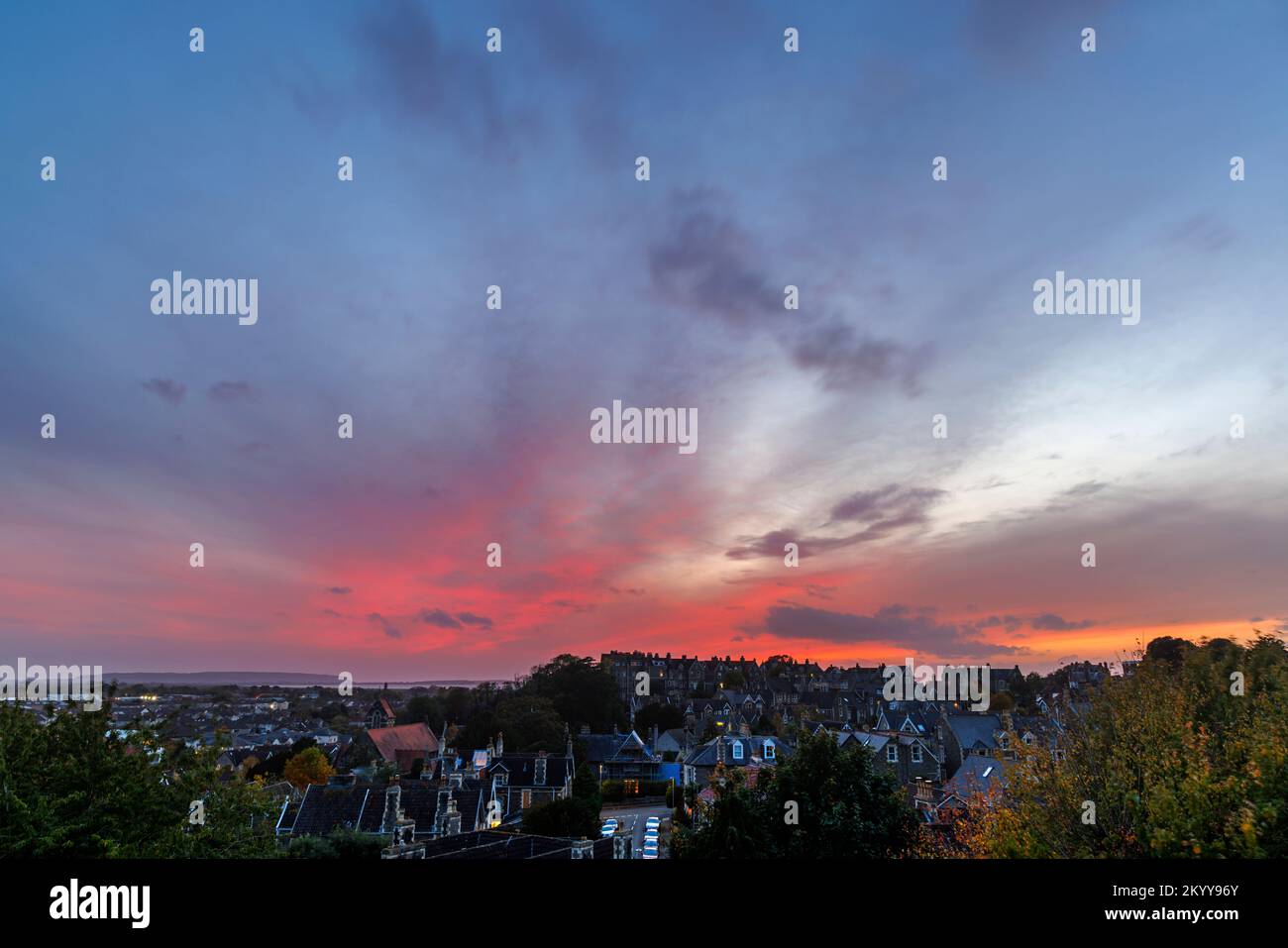 The setting sun lighting up the sky over Clevedon Stock Photo - Alamy