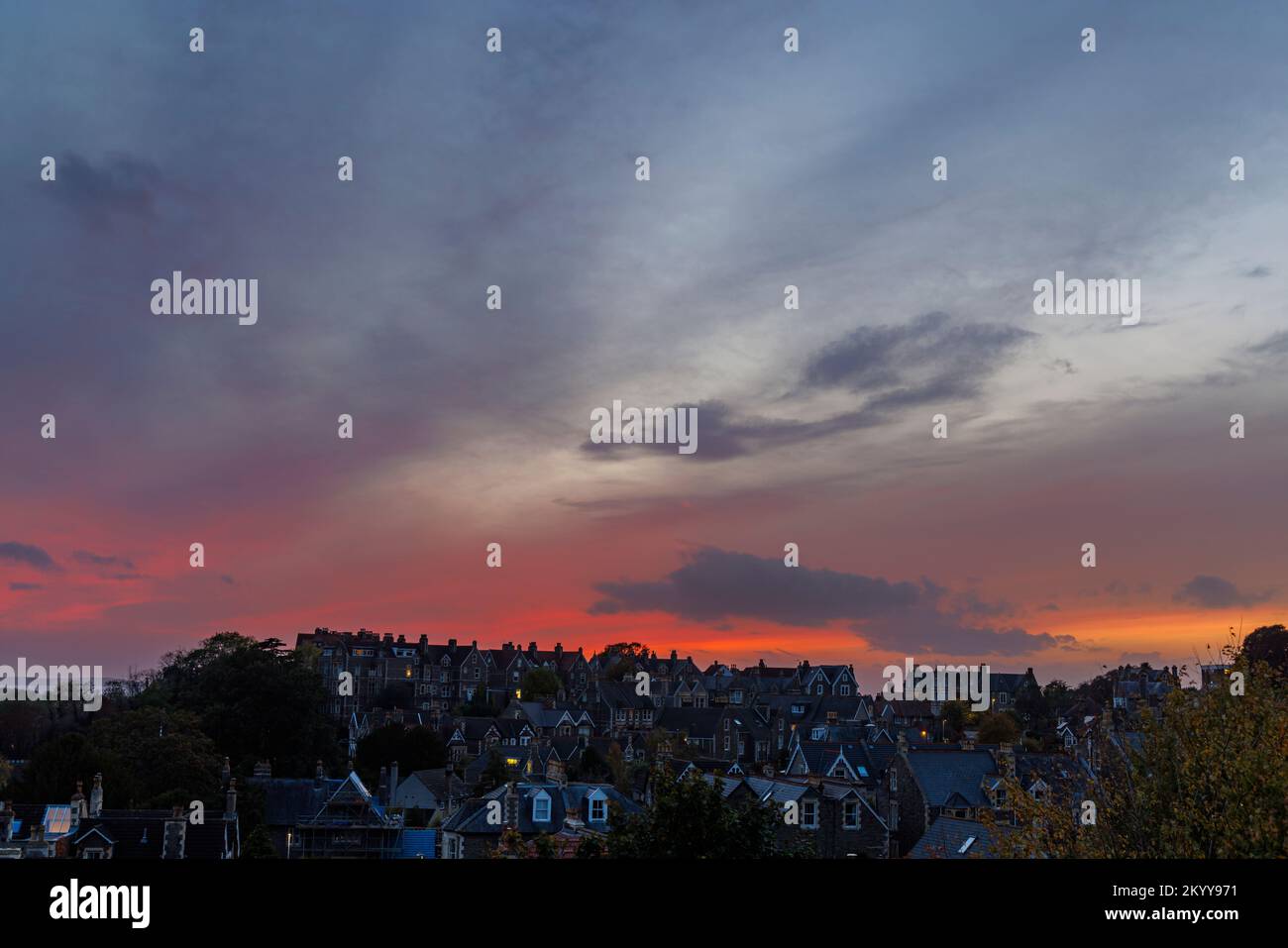 The setting sun lighting up the sky over Clevedon Stock Photo - Alamy