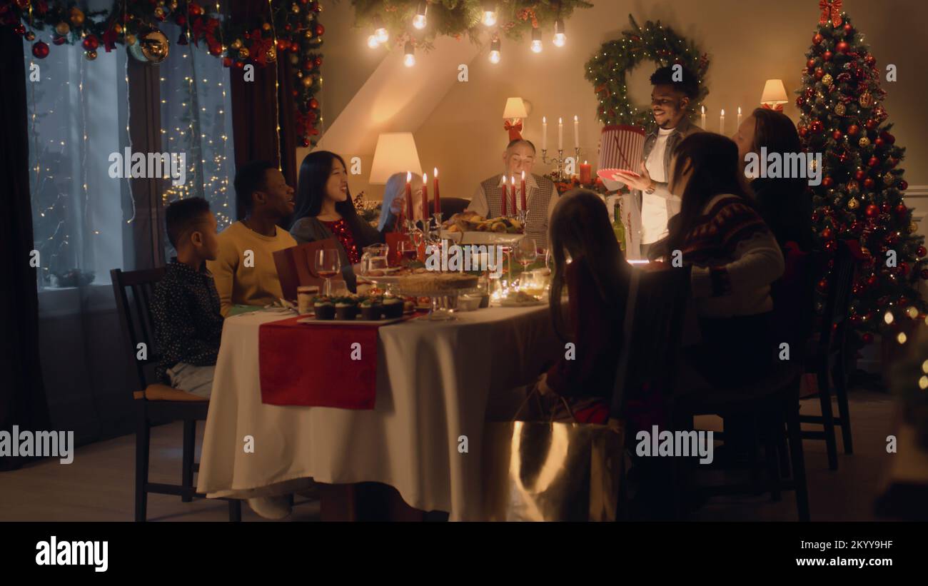 Happy multi cultural family celebrating Christmas or New Year 2023 ...