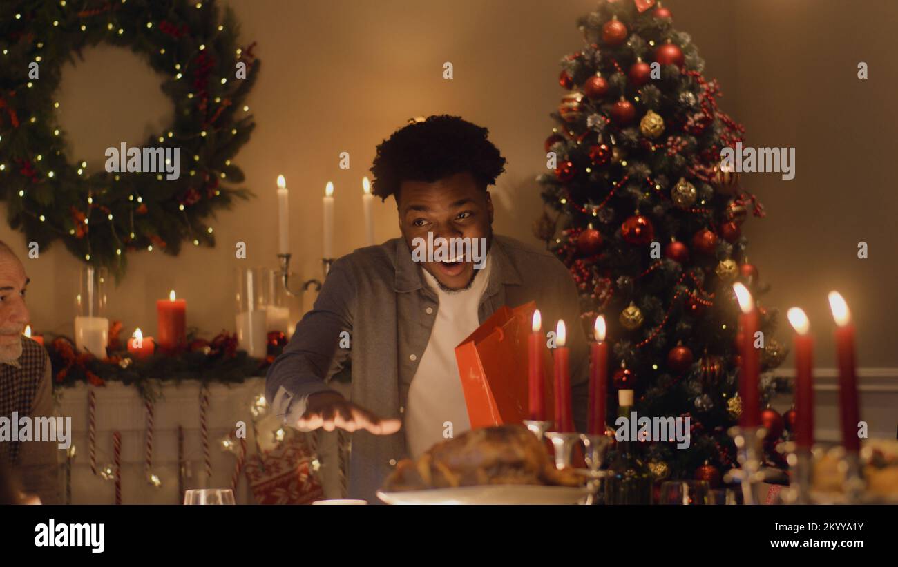 Happy multi cultural family celebrating Christmas or New Year 2023 ...