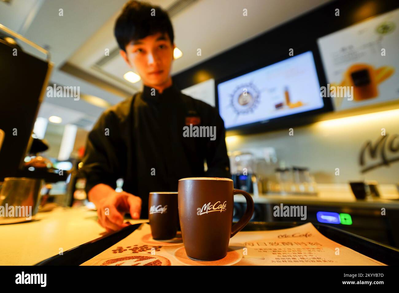 SHENZHEN, CHINA - OCTOBER 22, 2015: cup with hot coffee on the tray in ...