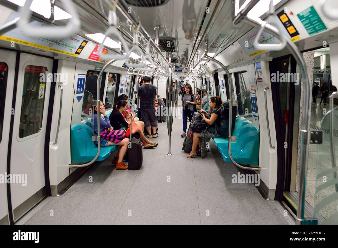 SINGAPORE - NOVEMBER 07, 2015: passengers in MRT train. The Mass Rapid ...