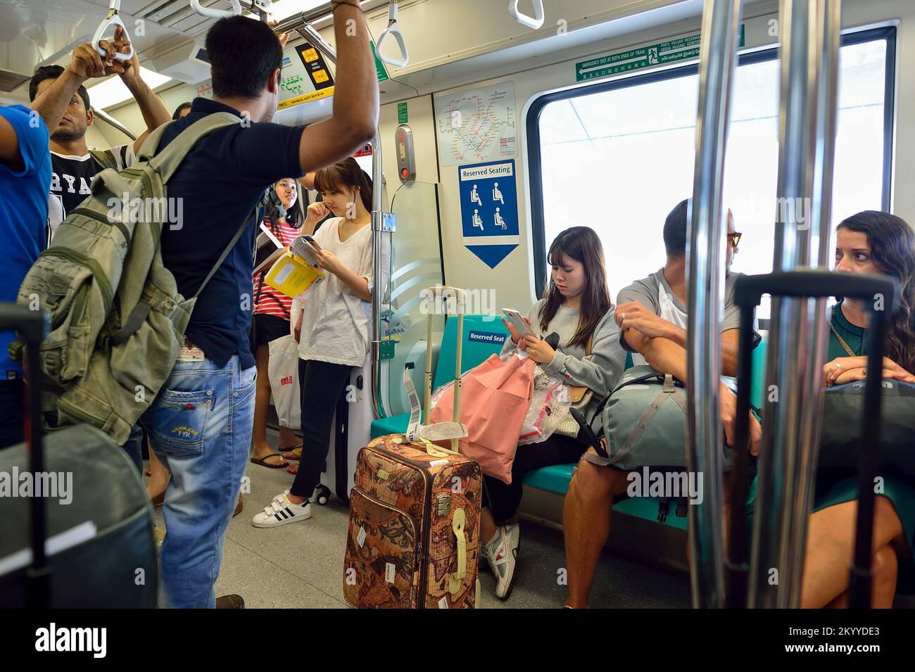 SINGAPORE - NOVEMBER 07, 2015: passengers in MRT train. The Mass Rapid ...
