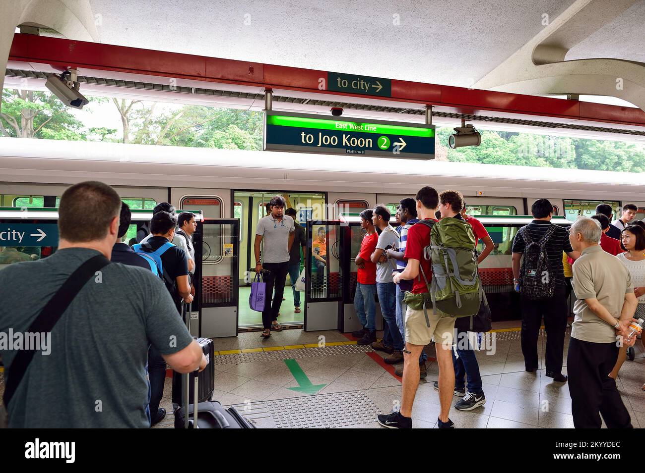 SINGAPORE - NOVEMBER 07, 2015: passengers at MRT station. The Mass ...