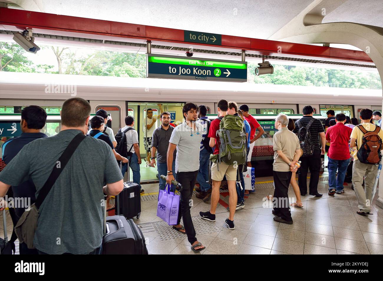 SINGAPORE - NOVEMBER 07, 2015: passengers at MRT station. The Mass ...