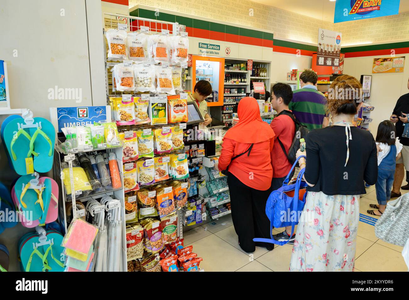 SINGAPORE - NOVEMBER 08, 2015: customers in 7-Eleven store. 7-Eleven is ...