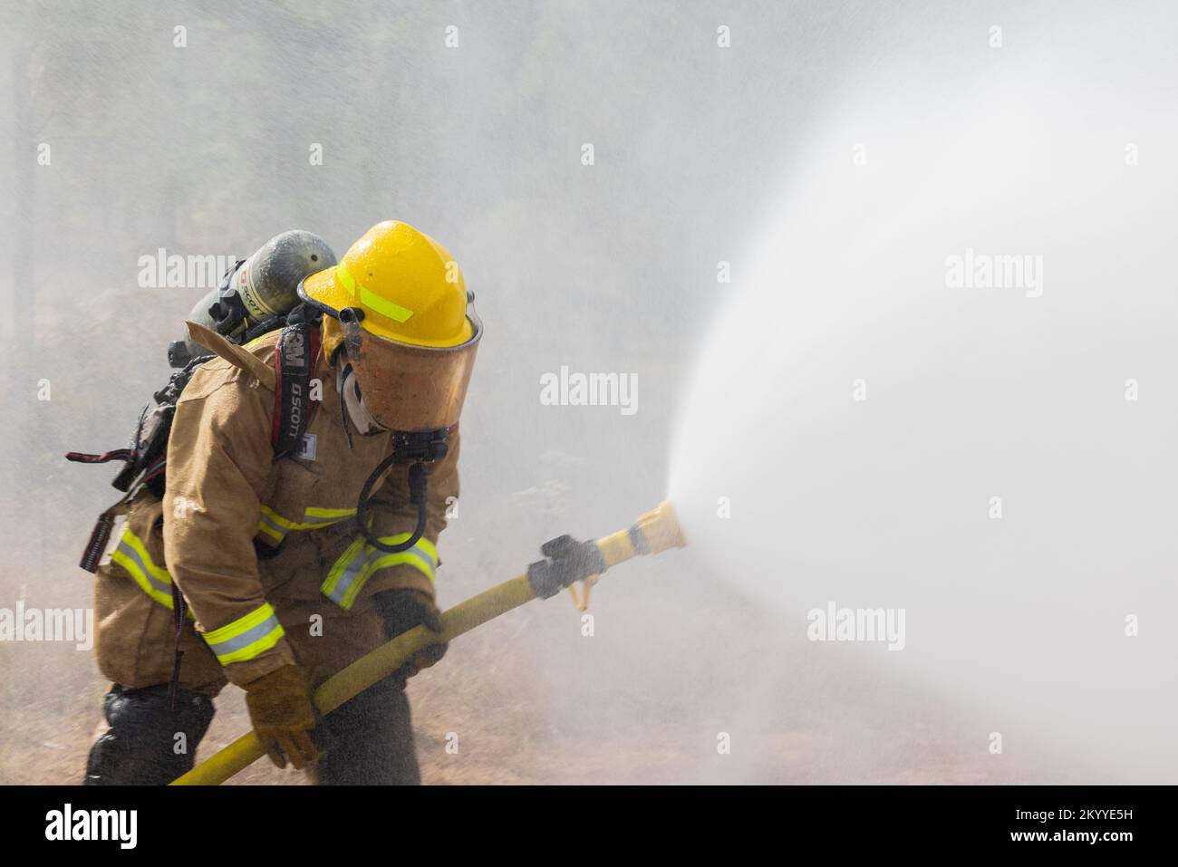 A U.S. Marine Corps firefighter with aircraft recovery and firefighting ...