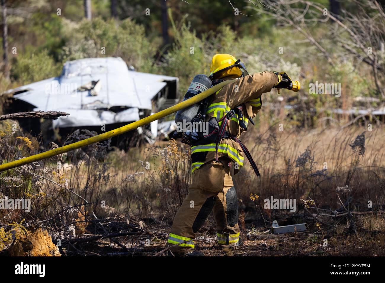 A U.S. Marine Corps firefighter with aircraft recovery and firefighting ...