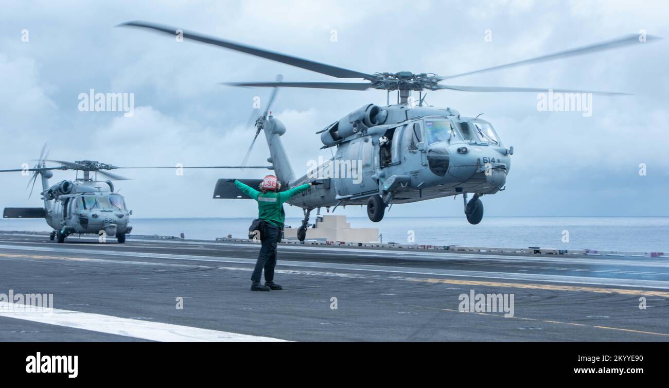 221130-N-UF592-1372 PHILIPPINE SEA (Nov. 30, 2022) An MH-60S Seahawk ...