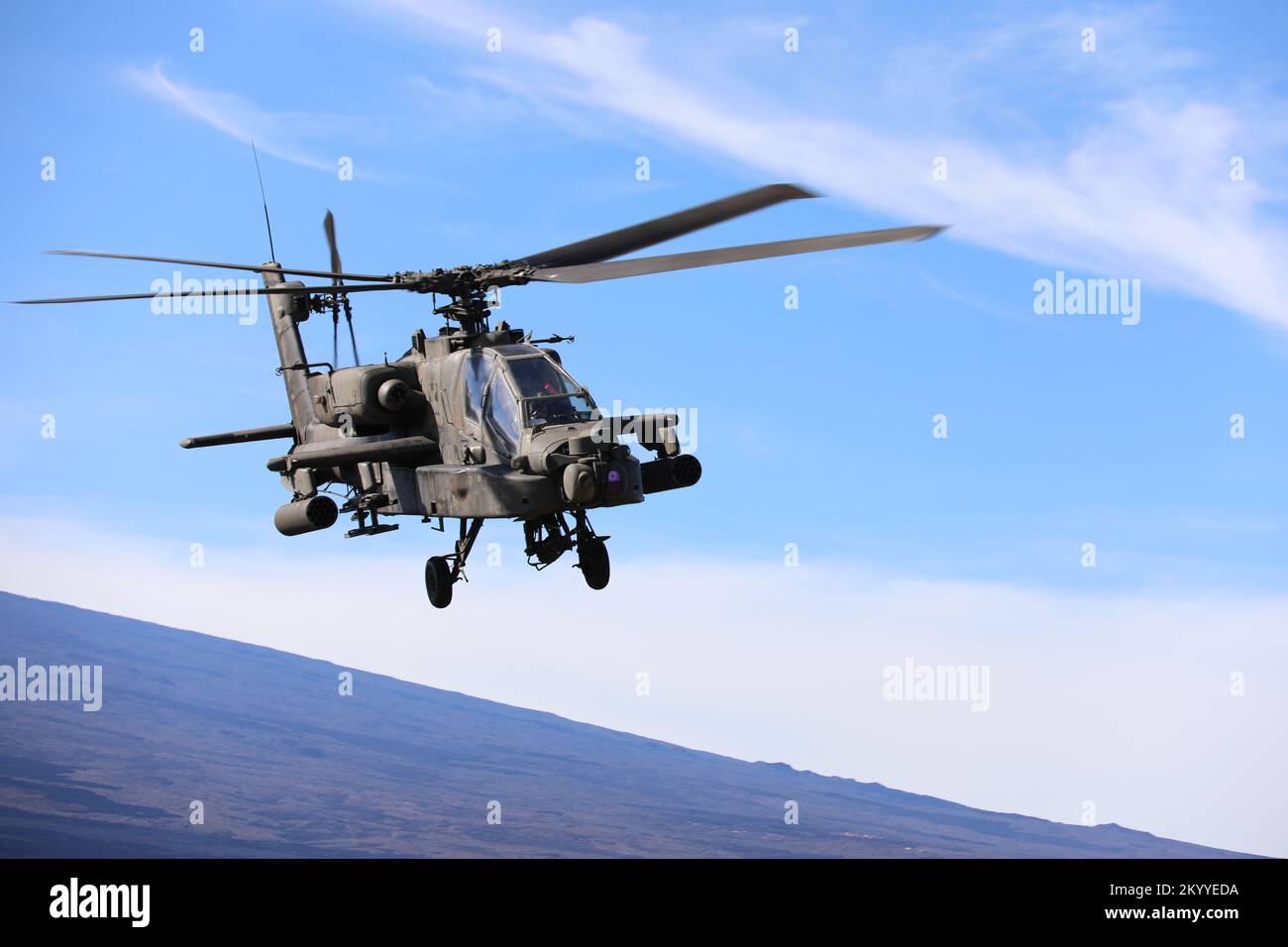 AH-64 Apache from the 25th Combat Aviation Brigade flies over Pohakuloa ...