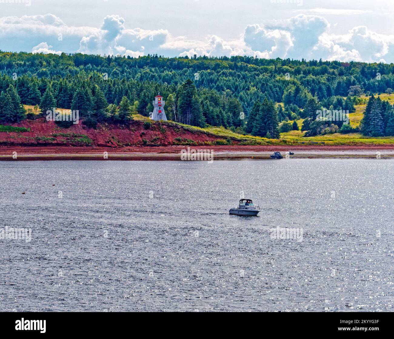 Fishing Boat Sailing from Lighthouse Stock Photo - Alamy