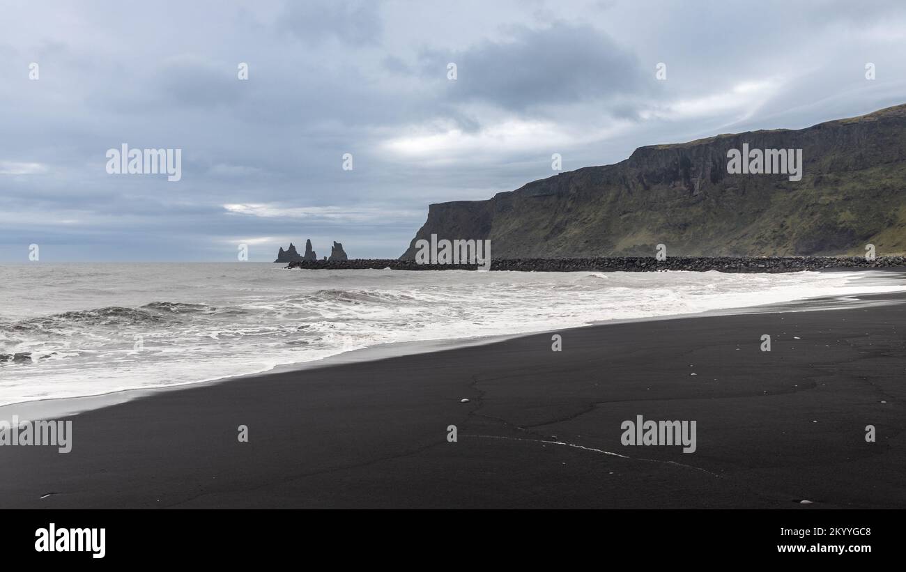 Vik's scenic volcanic black sand beach in Iceland is popular and iconic ...