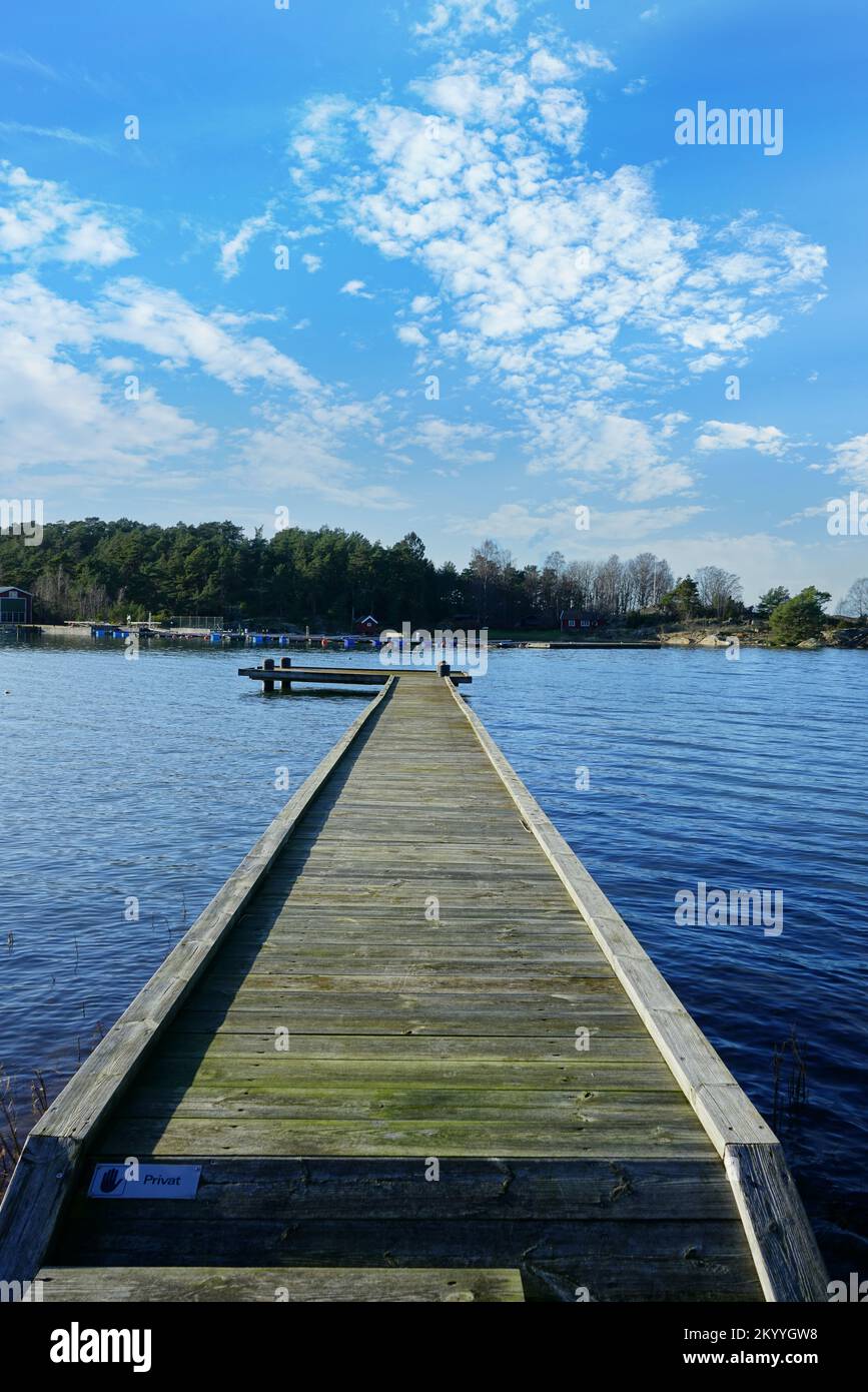 Sunny day long wood pier hi-res stock photography and images - Alamy
