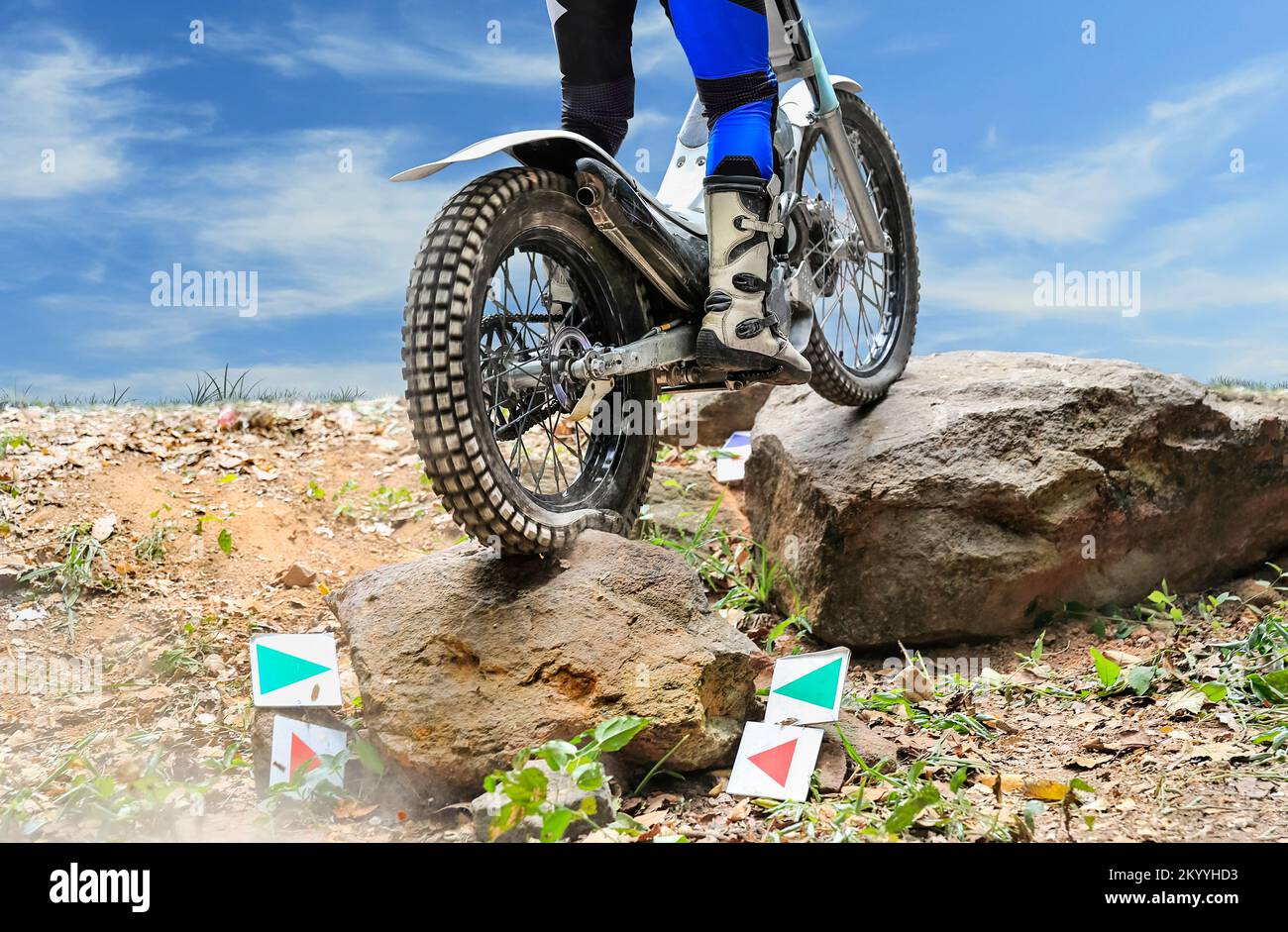 Trials motorcycle is jumping over rocks Stock Photo - Alamy